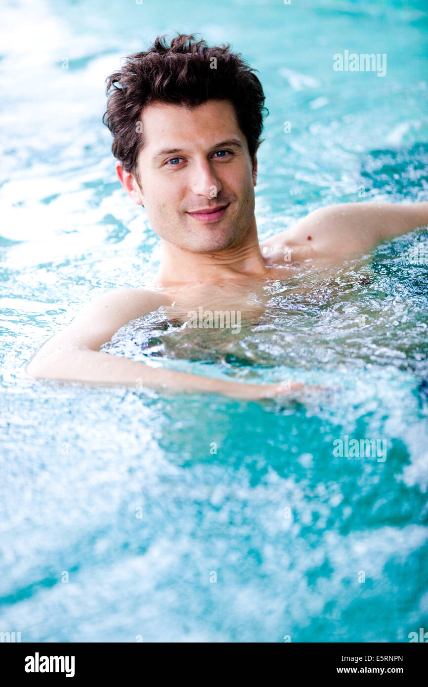 Man in spa pool Stock Photo - Alamy