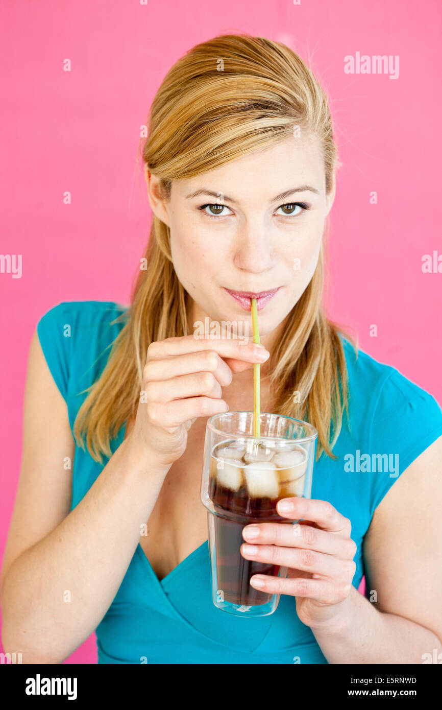 Woman drinking a cold drink Stock Photo - Alamy