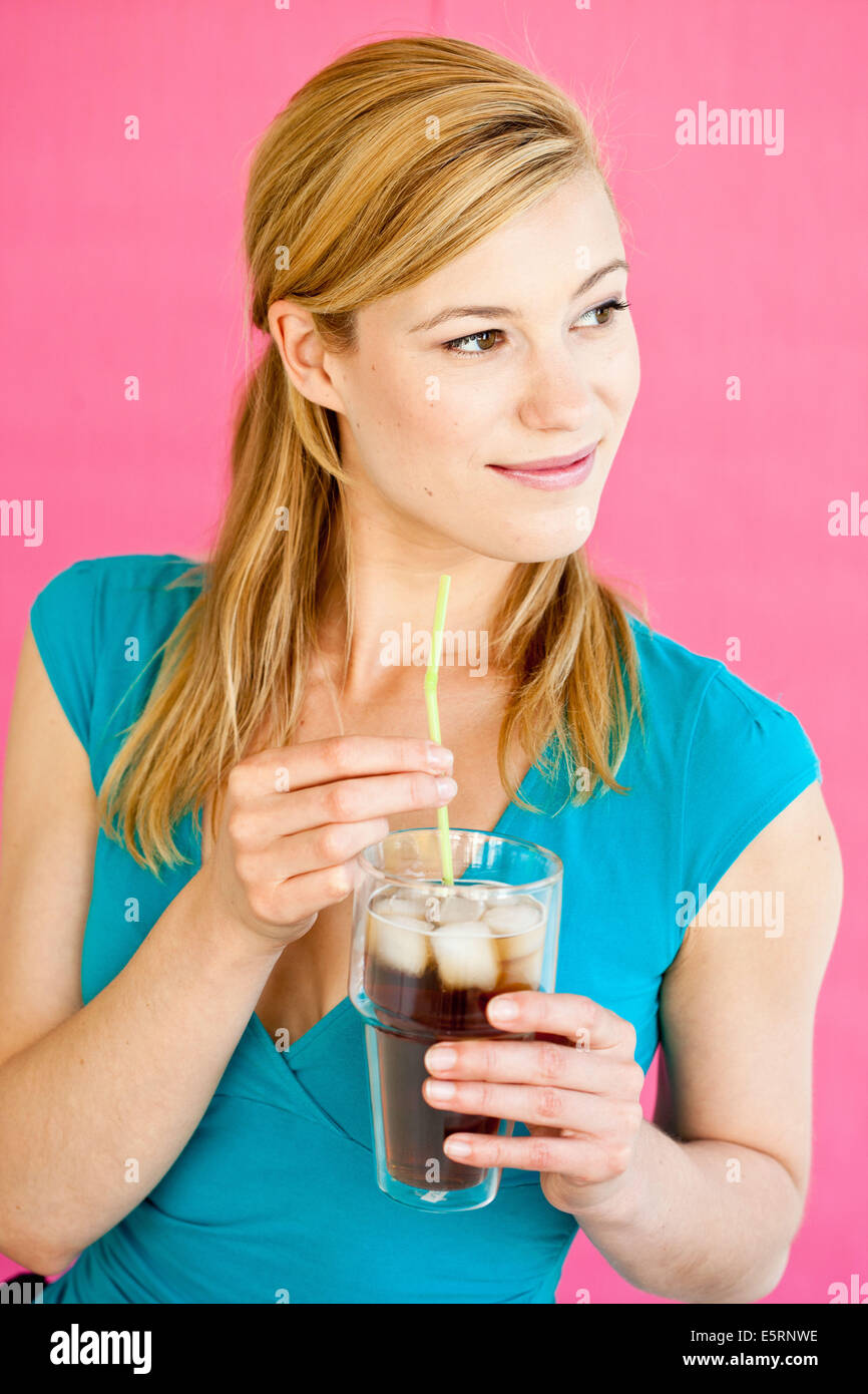 Woman drinking a cold drink Stock Photo - Alamy