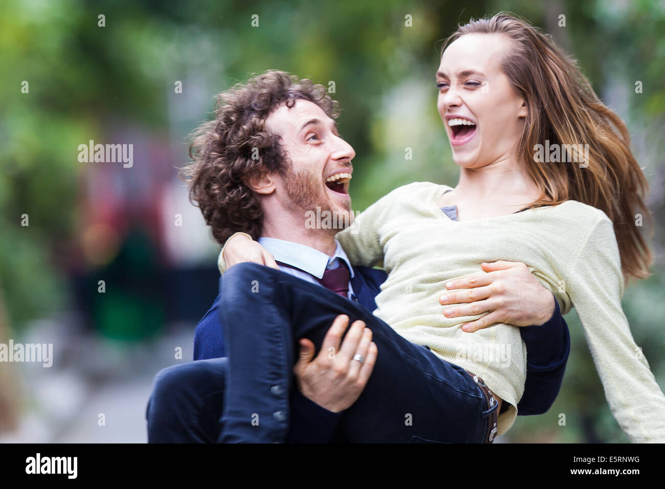 Man carrying woman Stock Photo - Alamy