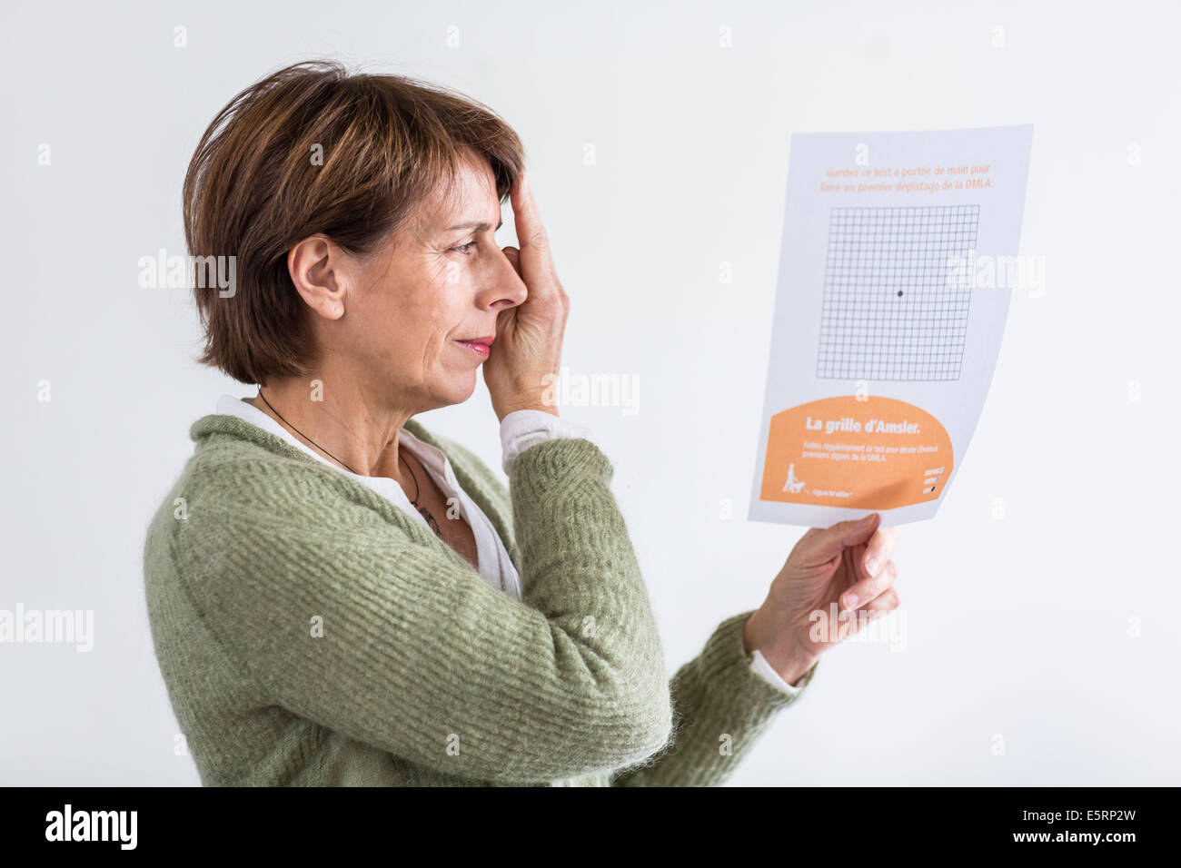 senior-woman-looking-at-an-amsler-grid-to-detect-macular-degeneration