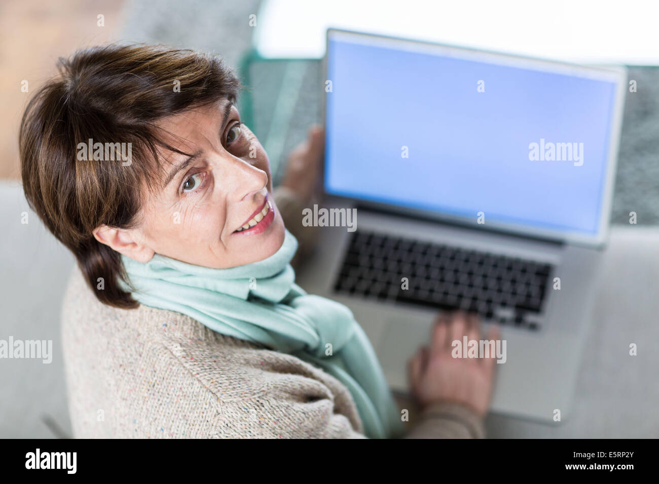 Senior woman using a laptop Stock Photo - Alamy