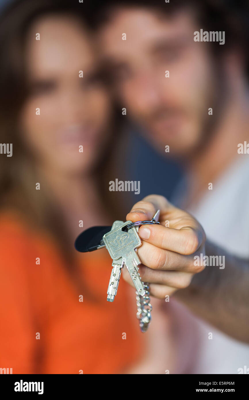 Couple with keys Stock Photo - Alamy