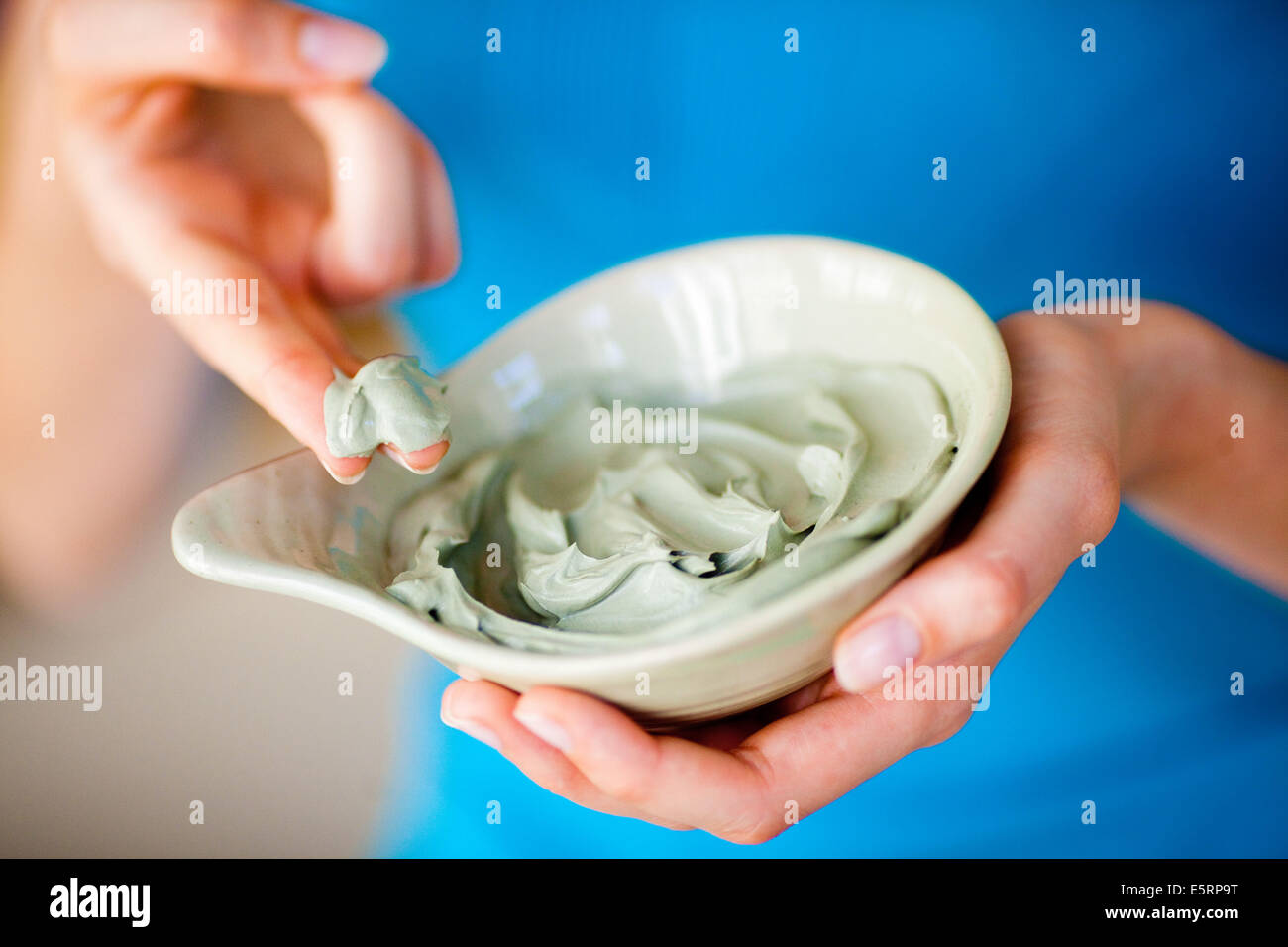 Woman preparing clay beauty mask Stock Photo - Alamy