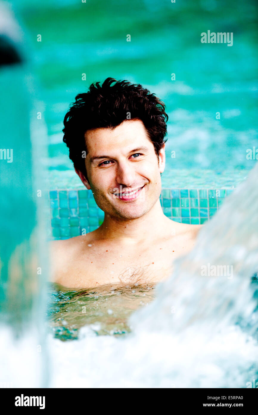 Man in spa pool Stock Photo - Alamy