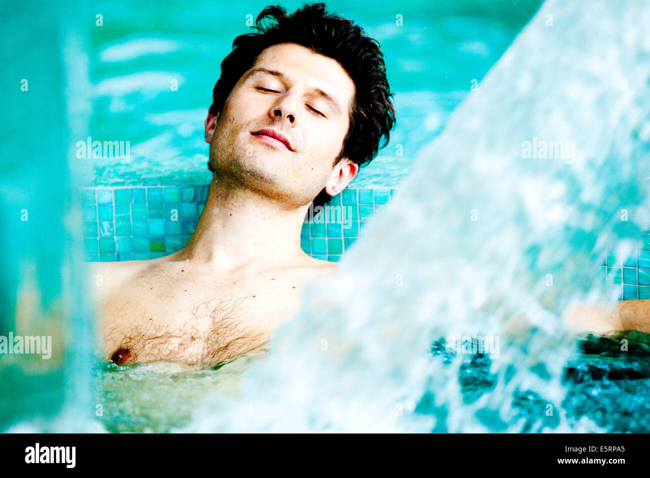 Man in spa pool Stock Photo - Alamy