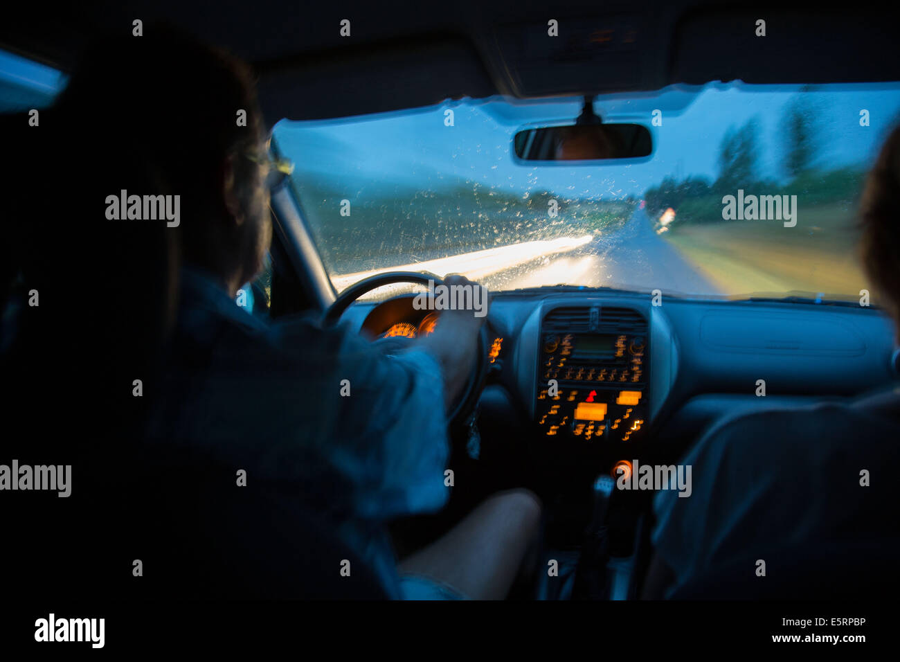Man driving car at night rain hi-res stock photography and images - Alamy