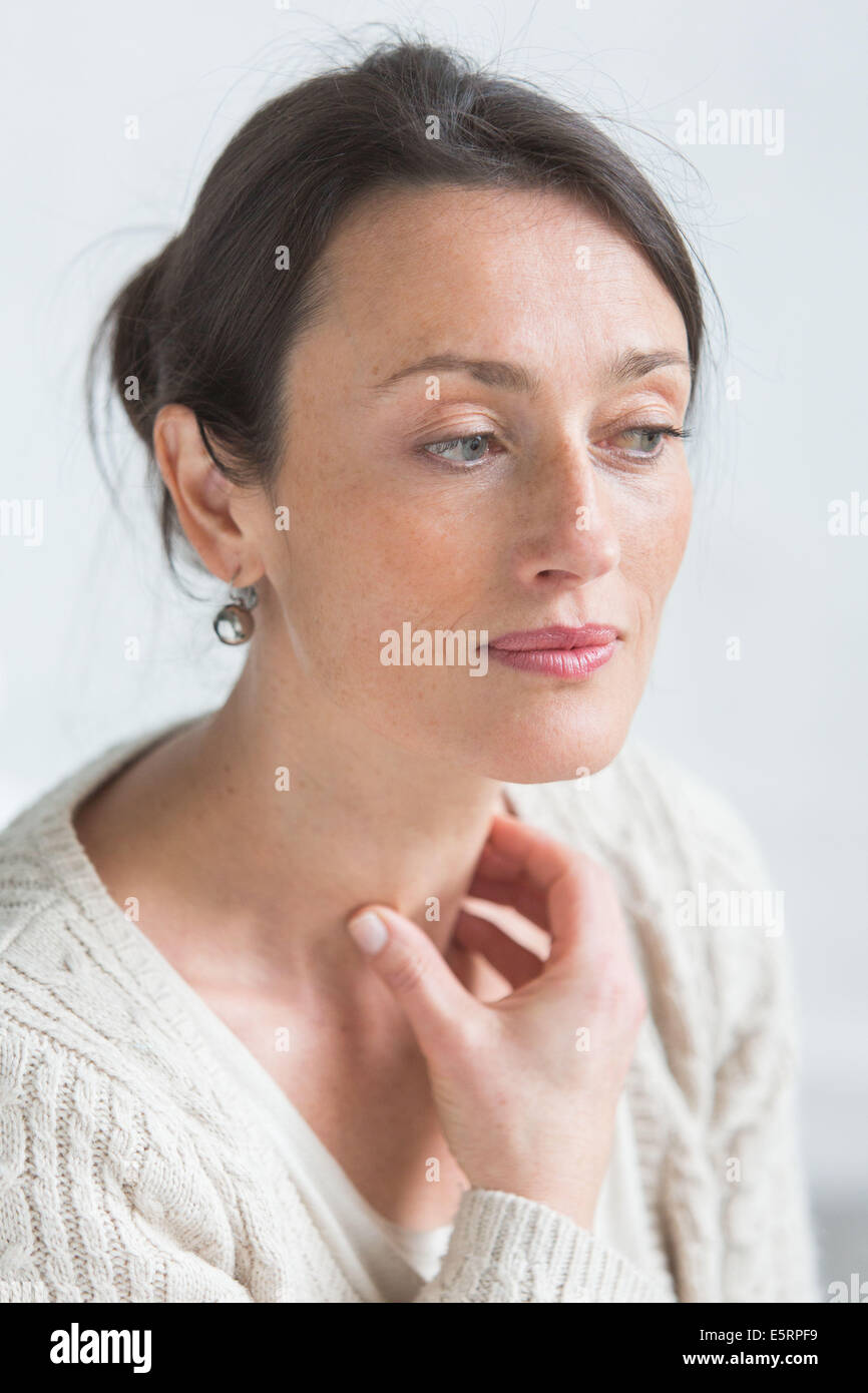 Woman self-examining her throat Stock Photo - Alamy