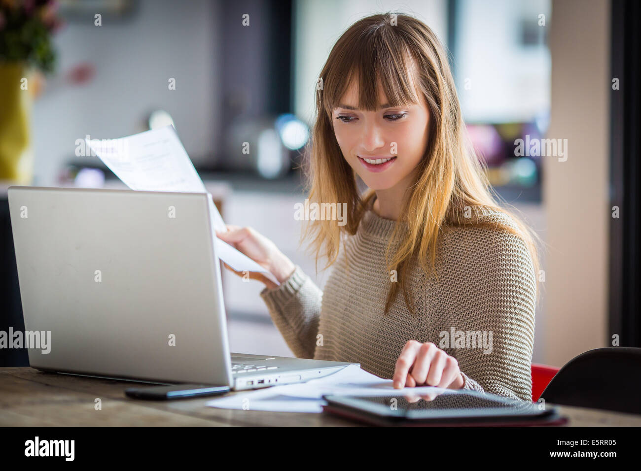 Woman using a laptop computer Stock Photo - Alamy