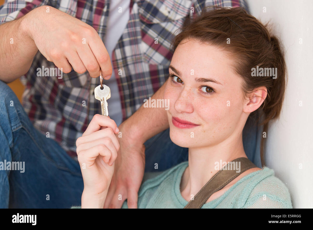Young couple holding new house keys Stock Photo - Alamy