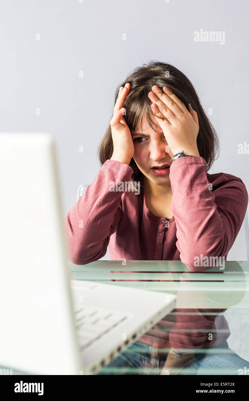 9-year-old girl using laptop computer Stock Photo - Alamy