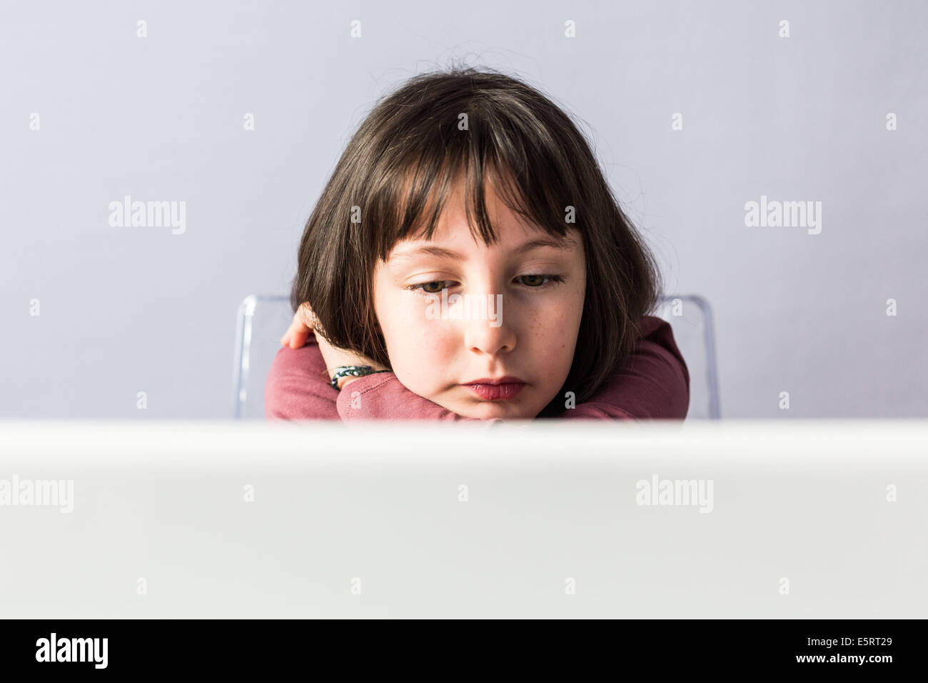 9-year-old girl using laptop computer Stock Photo - Alamy