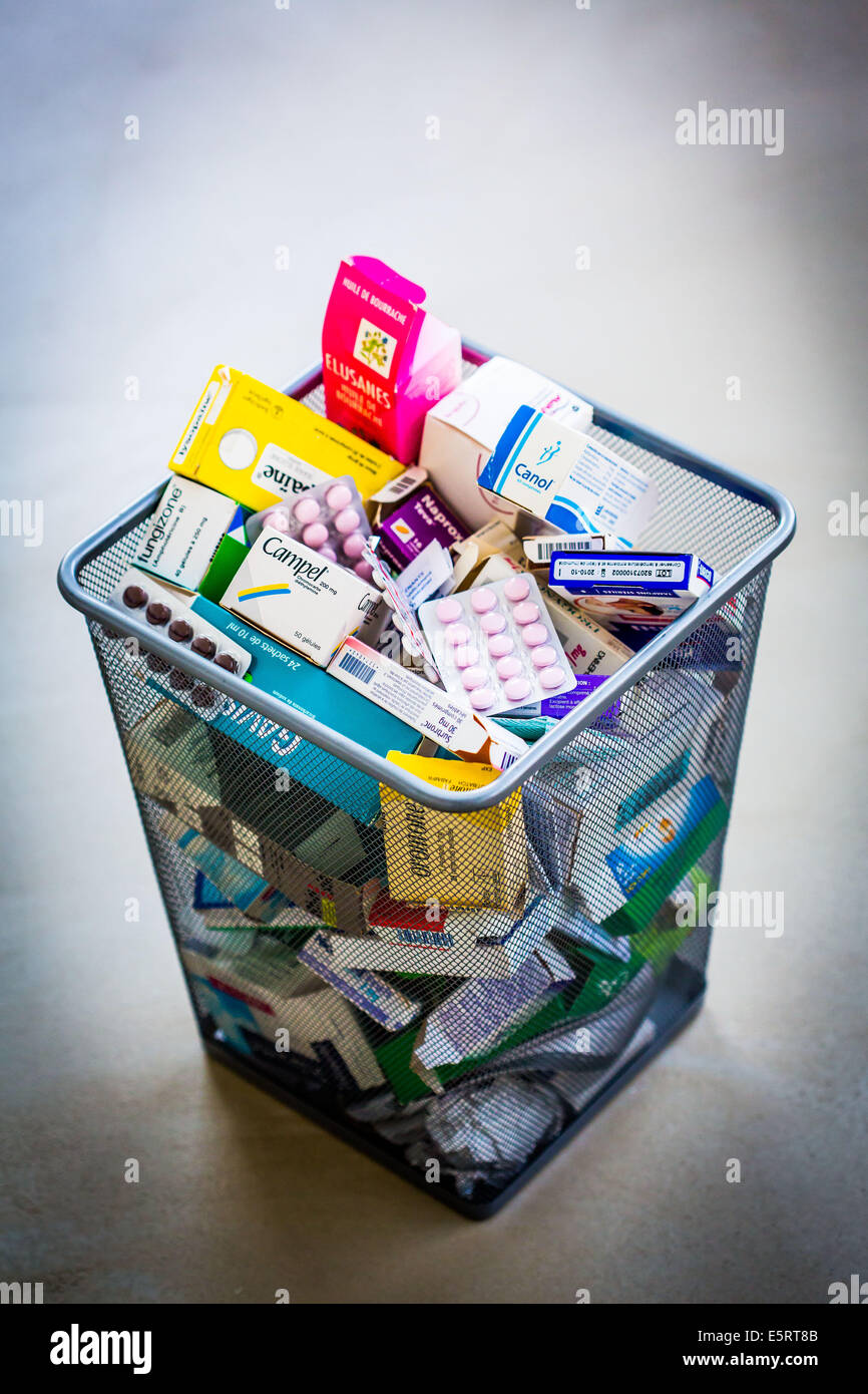 Drugs dumped into a trash can Stock Photo - Alamy