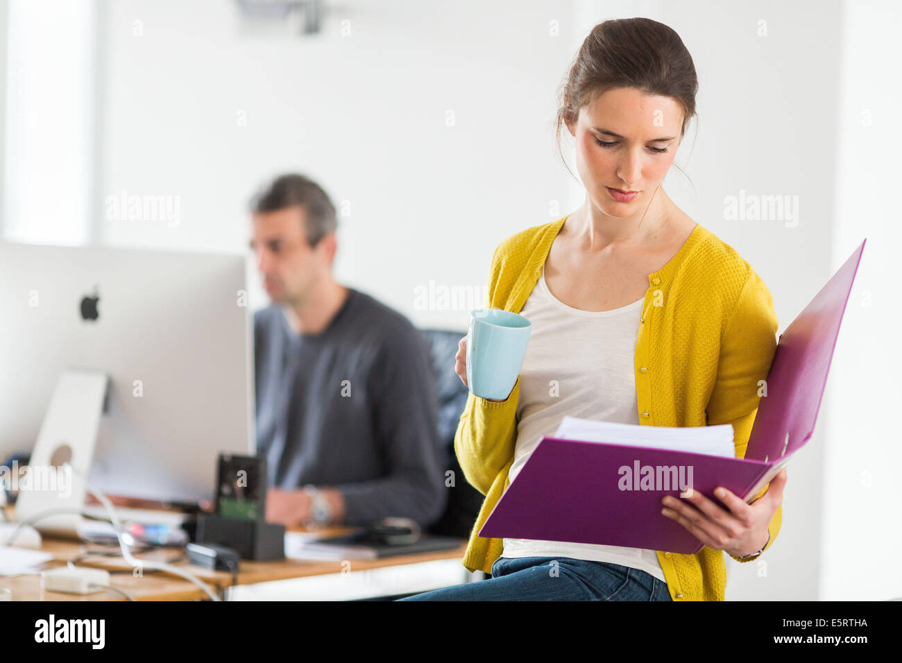 Office worker at desk Stock Photo - Alamy