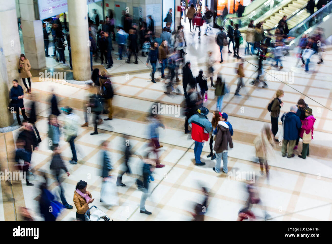 Crowd in a lobby Stock Photo - Alamy