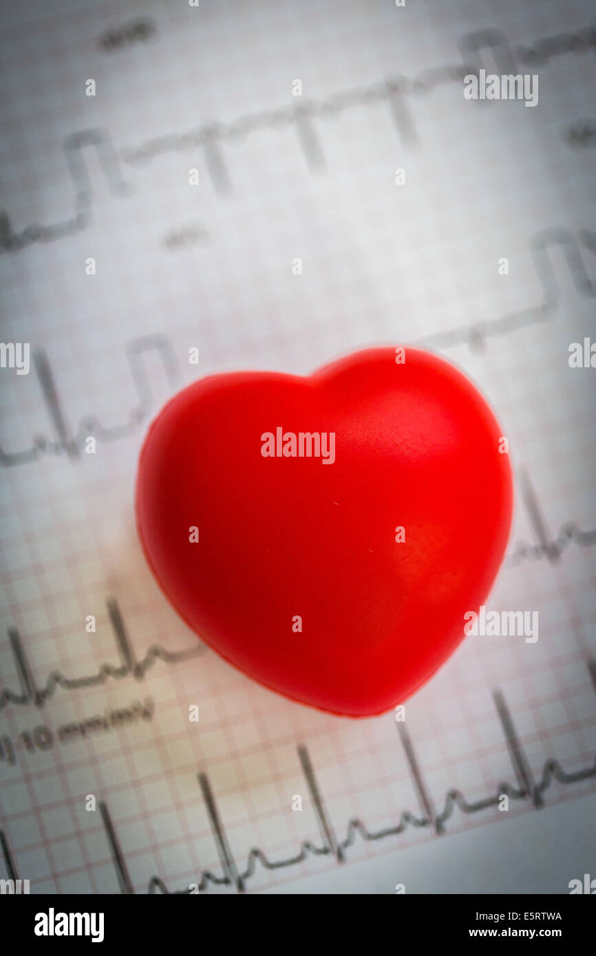 Plastic heart on an electrocardiogram trace Stock Photo - Alamy