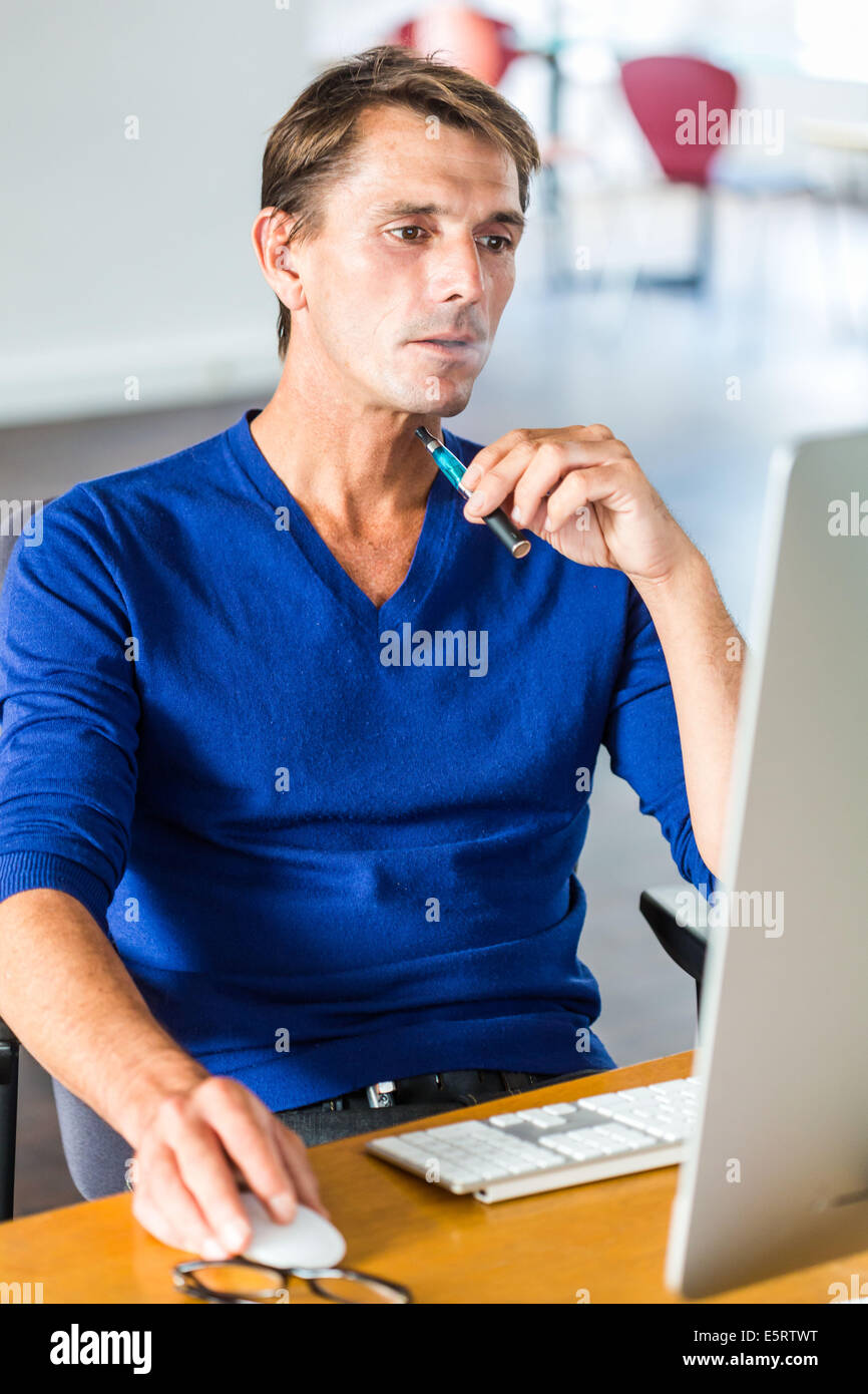 Man smoking electronic cigarette Stock Photo - Alamy