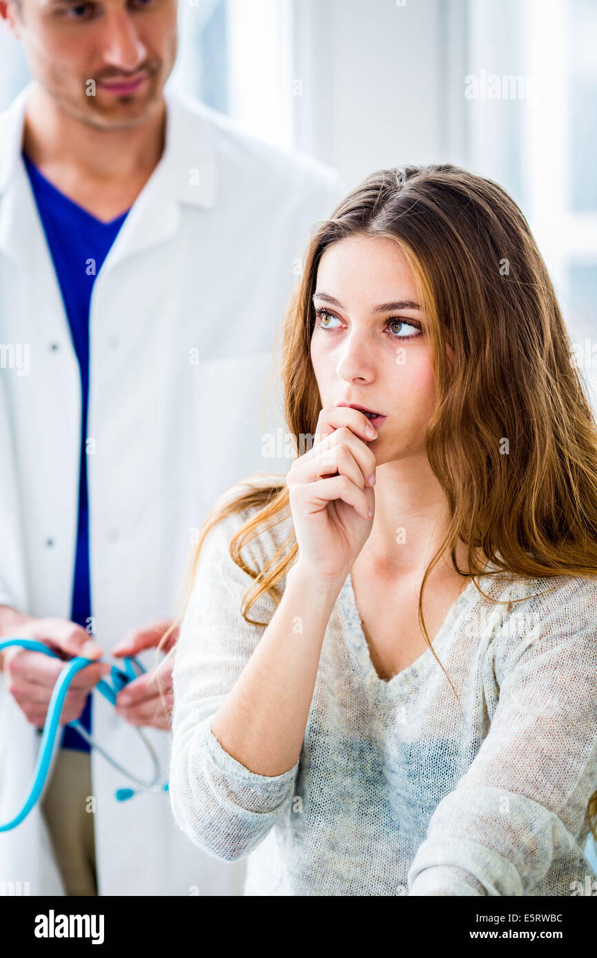 Doctor talking with a female patient Stock Photo - Alamy