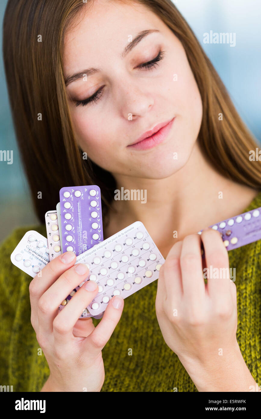 Woman holding contraceptive pills Stock Photo - Alamy