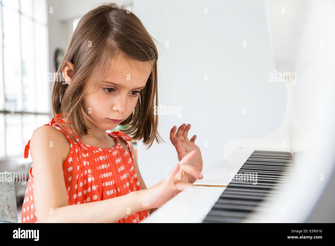 5 year old Girl Playing The Piano Stock Photo Alamy