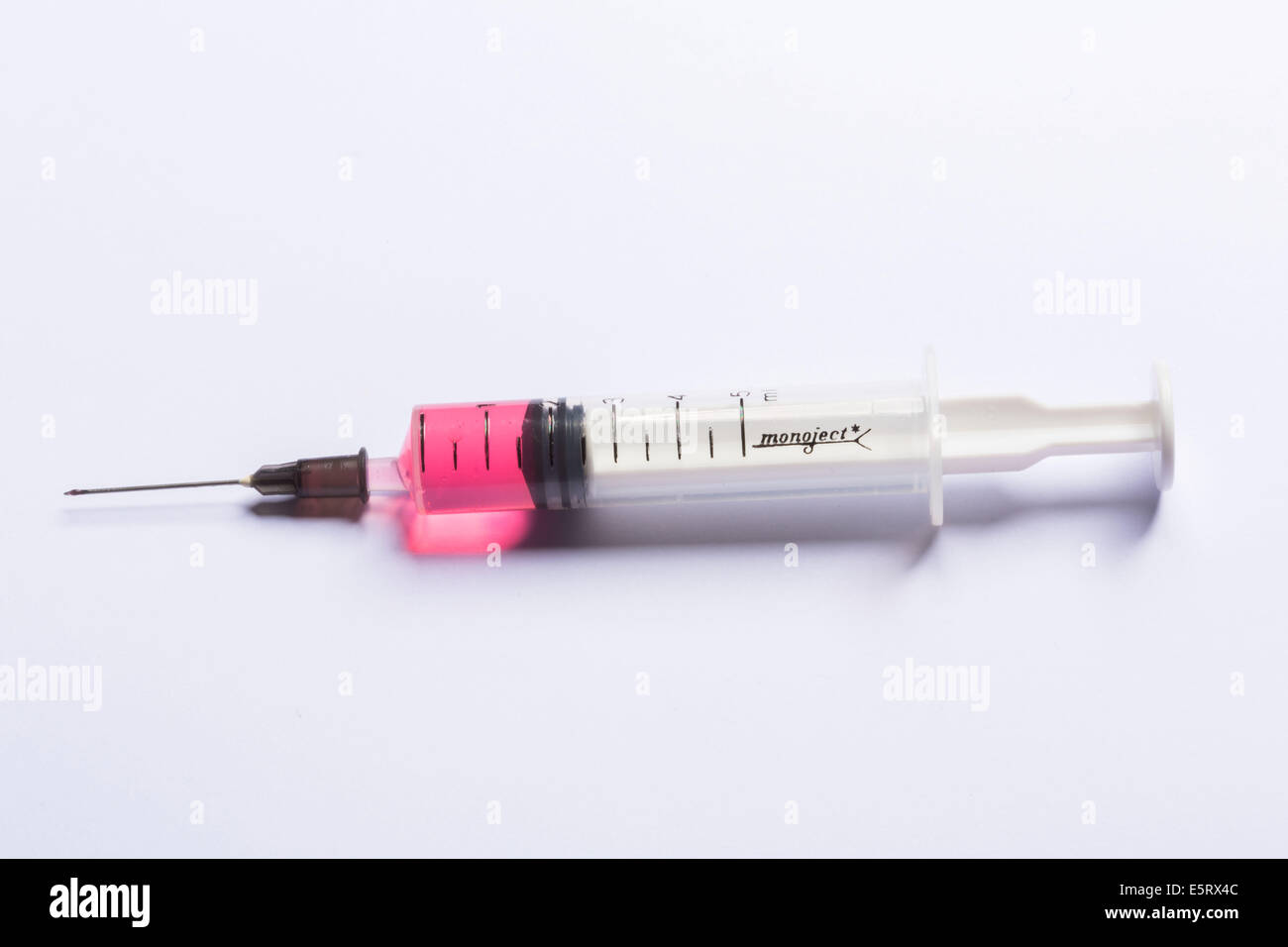 Syringe filled with pink liquid Stock Photo - Alamy Syringe filled with pink liquid Stock Photo - Alamy