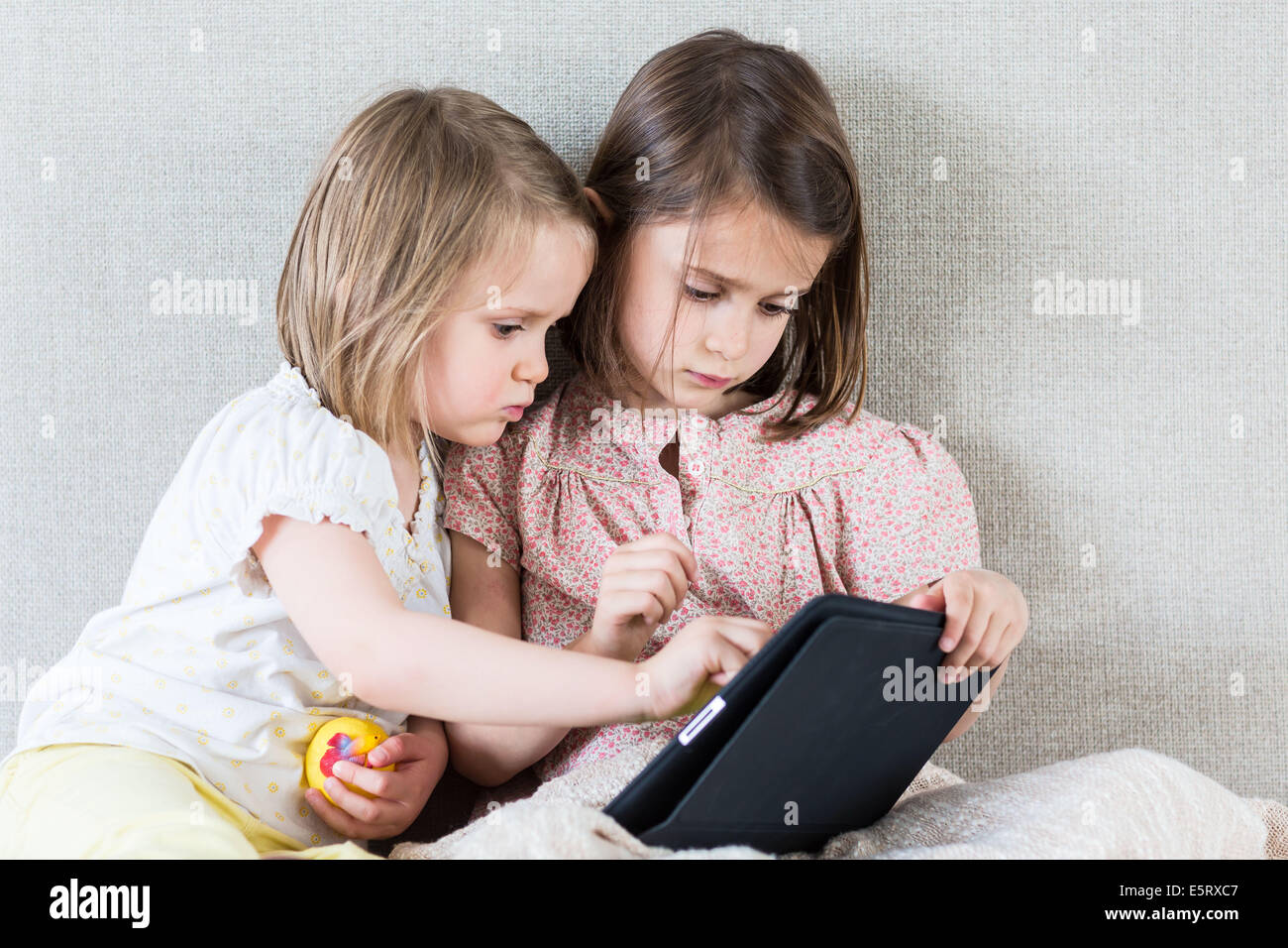 Girls using iPad® Stock Photo - Alamy