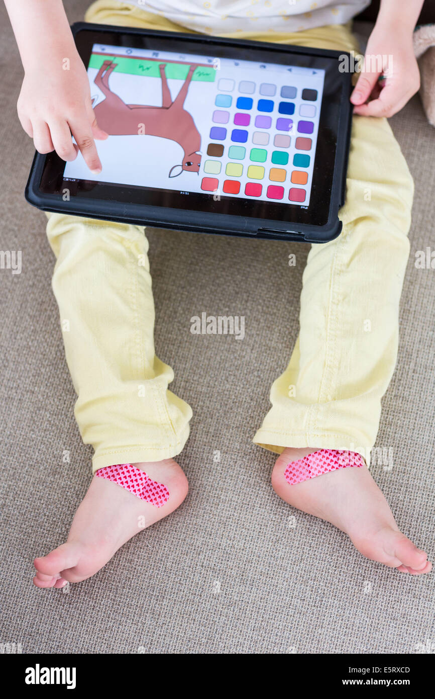 Girl using iPad® Stock Photo - Alamy