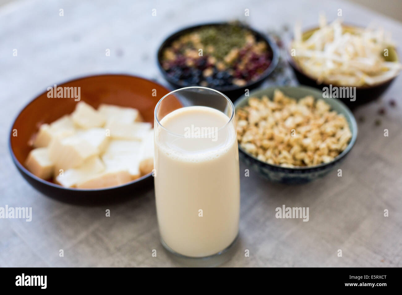 Soybean sprouts, soja beans and soya protein chunks and soja milk glass ...