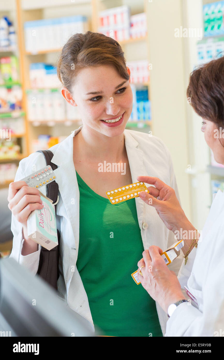 Pharmacist showing generic contraceptive pills Stock Photo - Alamy