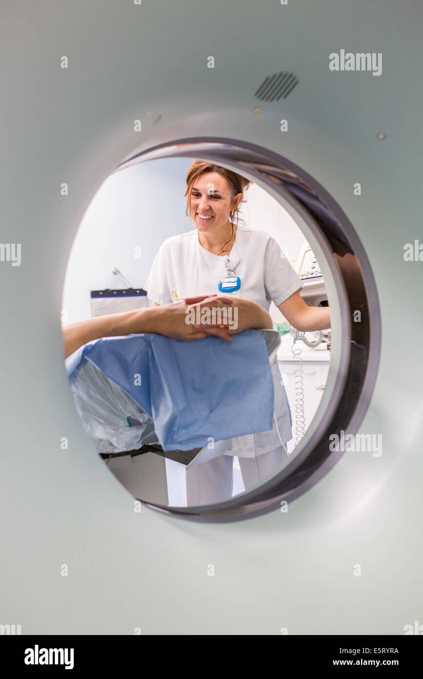 Female patient undergoing a CT scan, Angoulême hospital, France Stock ...