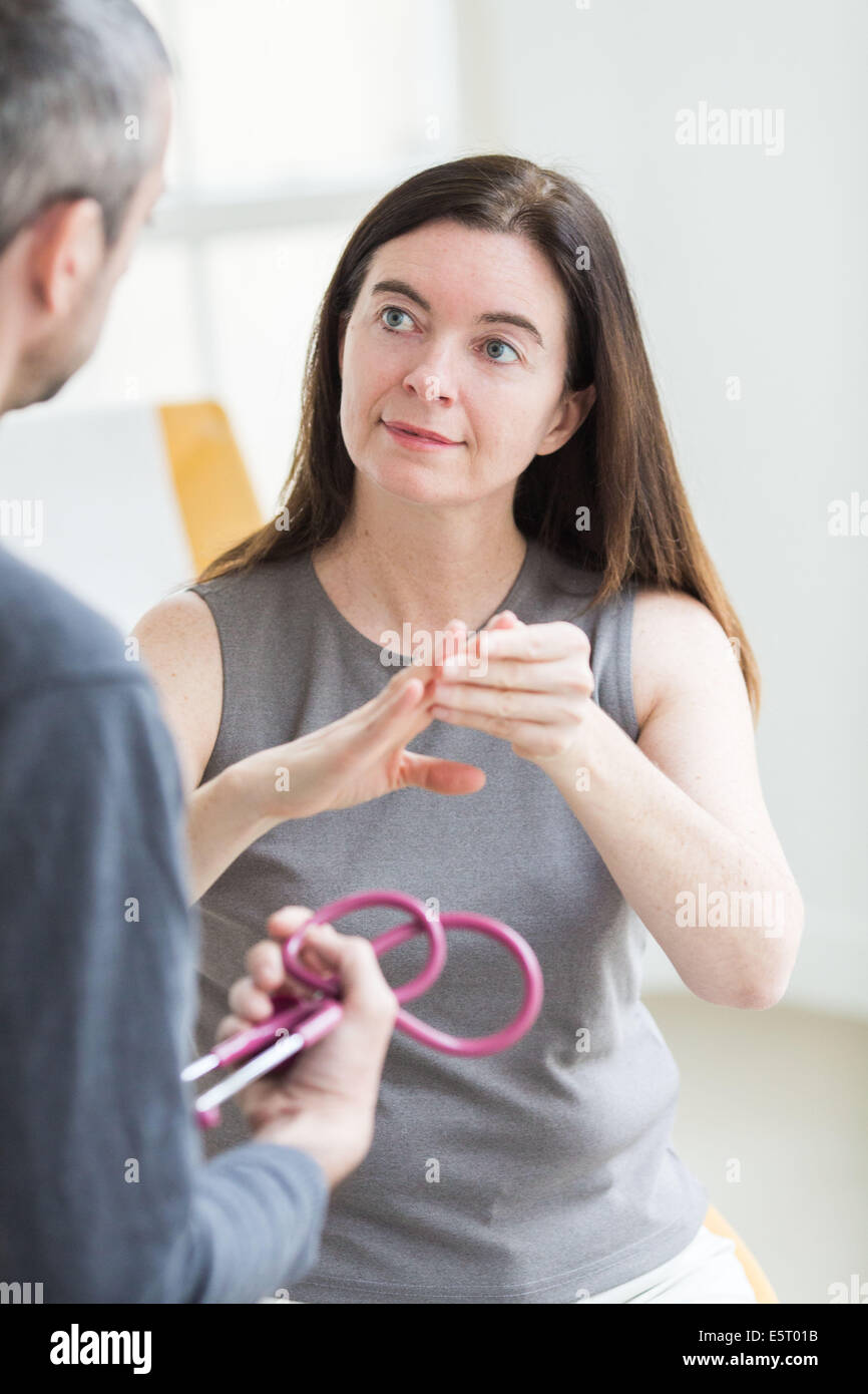 Doctor examining hand of a patient Stock Photo - Alamy