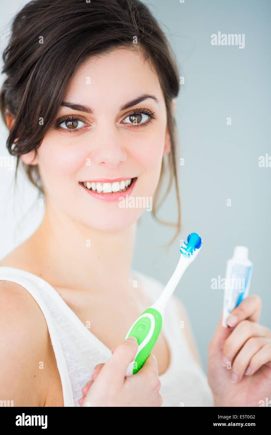 Woman brushing her teeth Stock Photo - Alamy