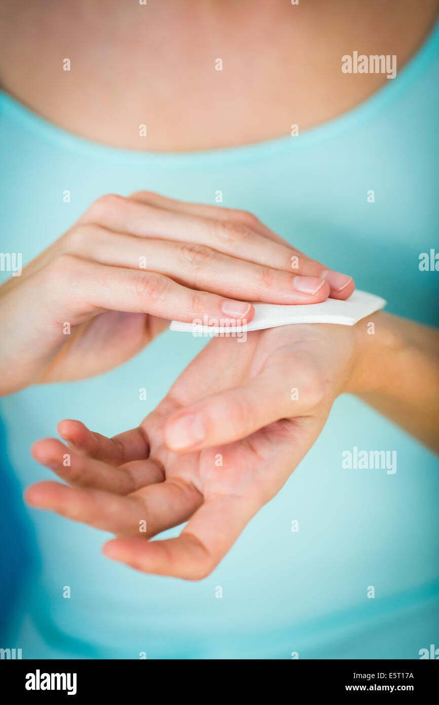 Woman applying gauze compress on her hand Stock Photo - Alamy