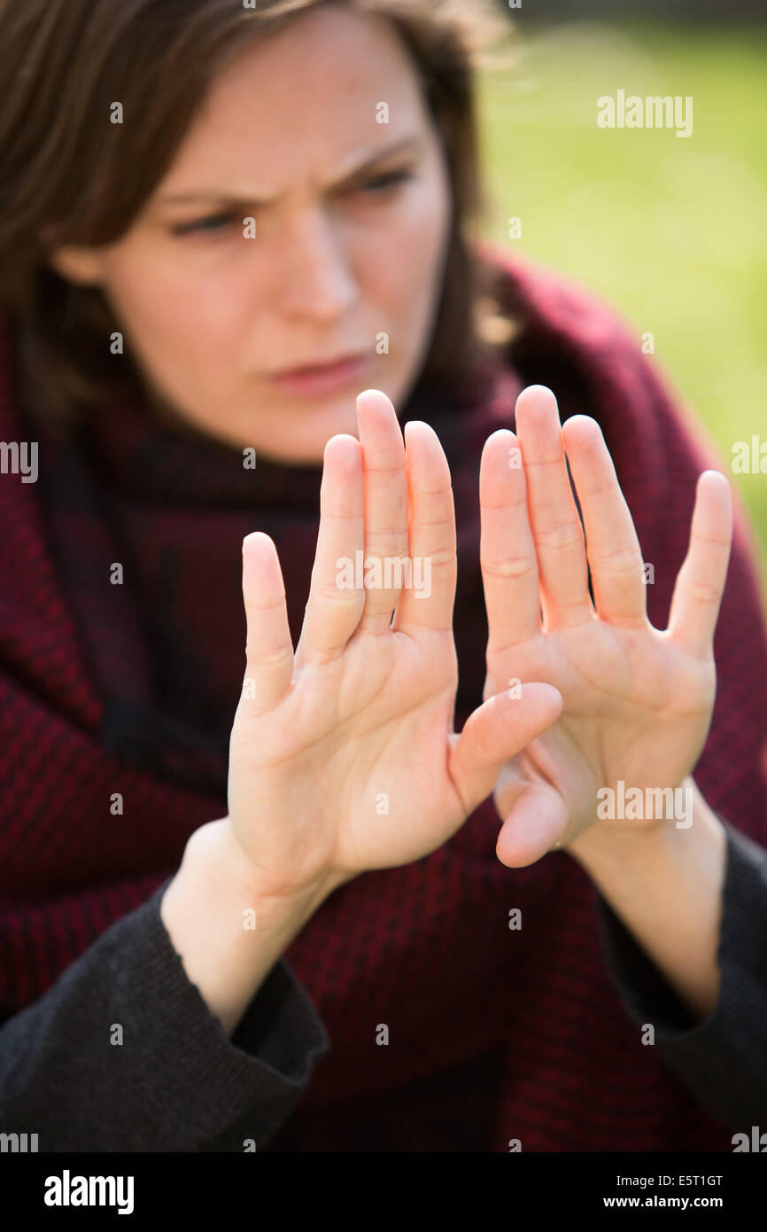 Woman watching her hands Stock Photo - Alamy