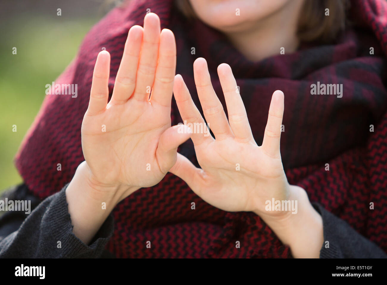 Woman watching her hands Stock Photo - Alamy