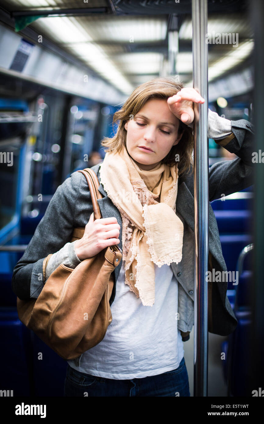 Woman subway eyes closed hi-res stock photography and images - Alamy