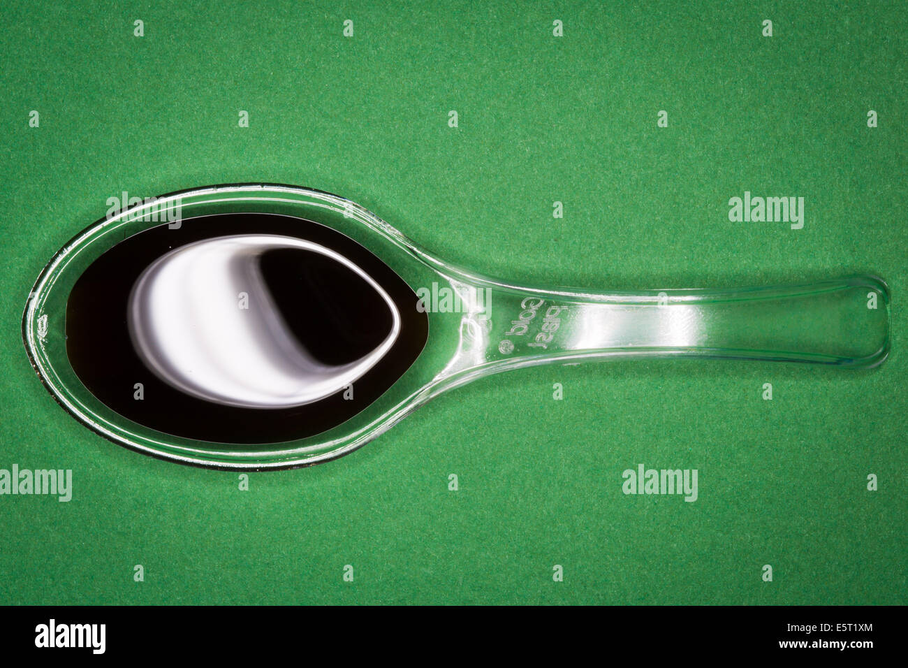 Spoonful of syrup Stock Photo - Alamy