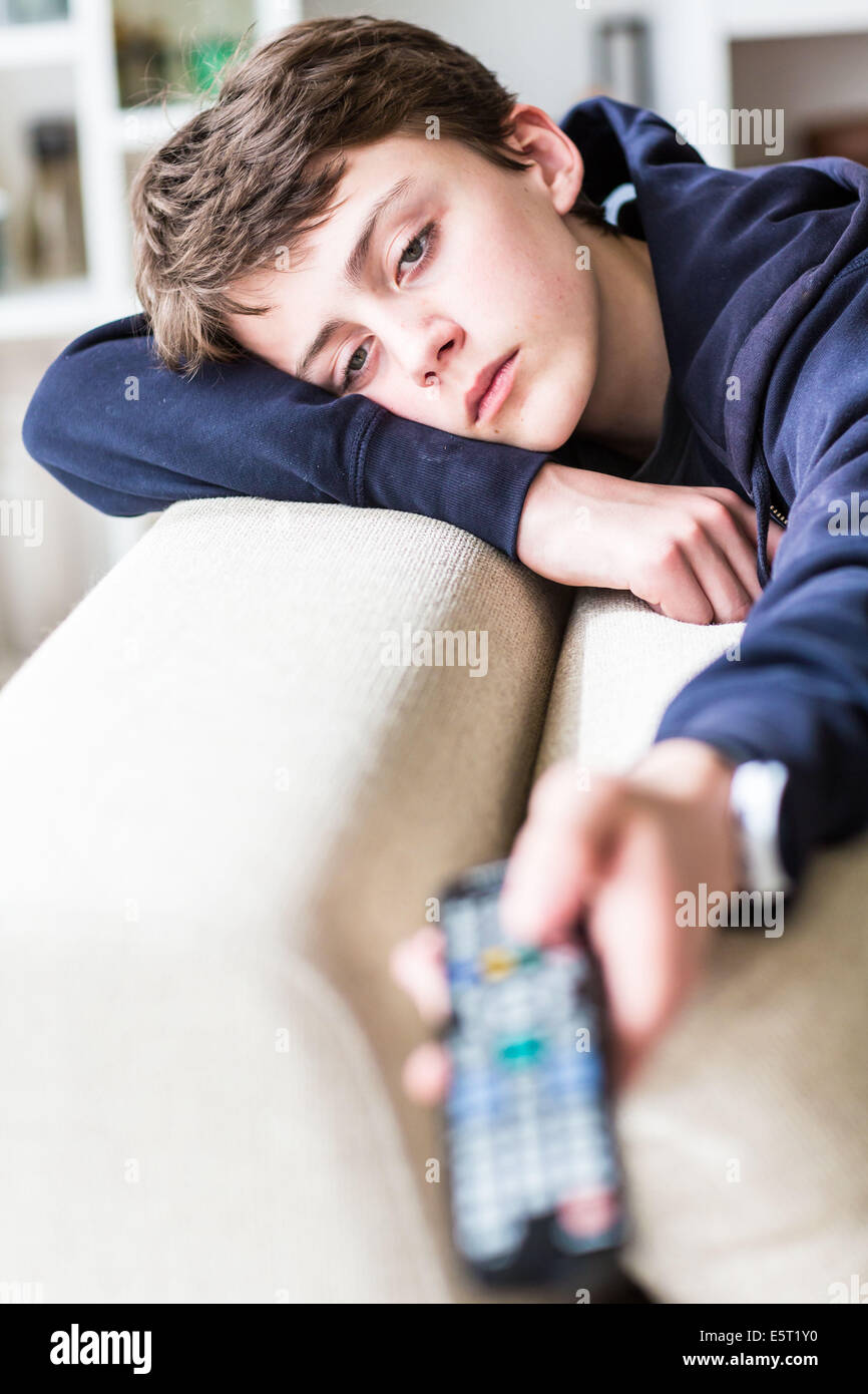 Teenage boy watching TV Stock Photo - Alamy