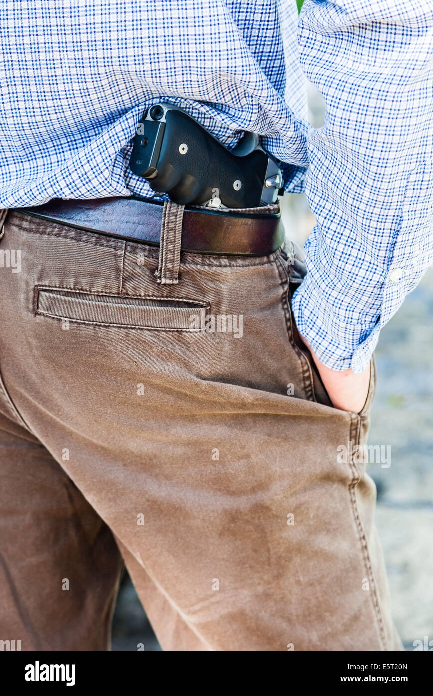 Man wearing a revolver Stock Photo - Alamy
