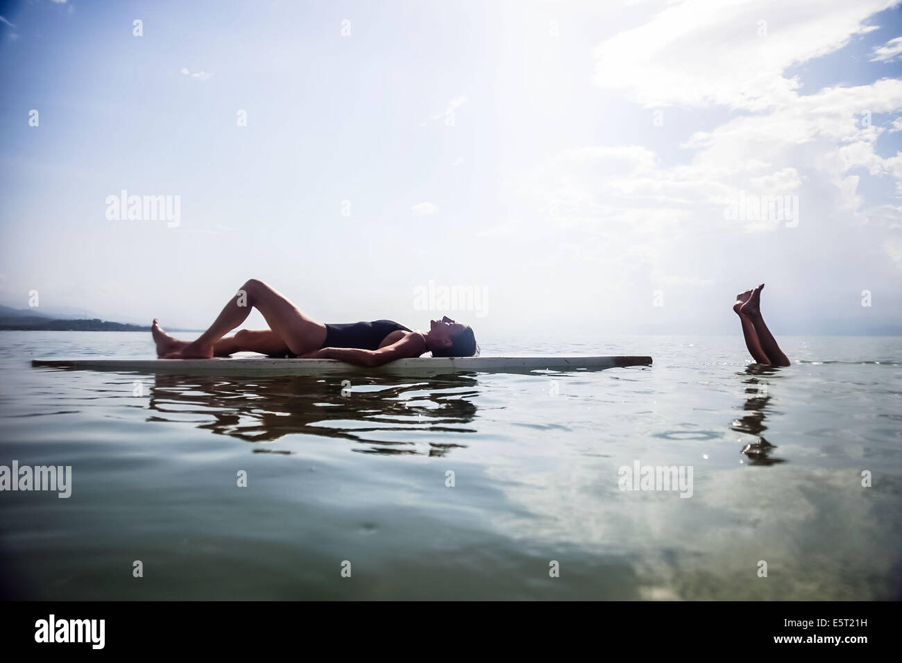 Woman pond sunbathing hi-res stock photography and images - Alamy