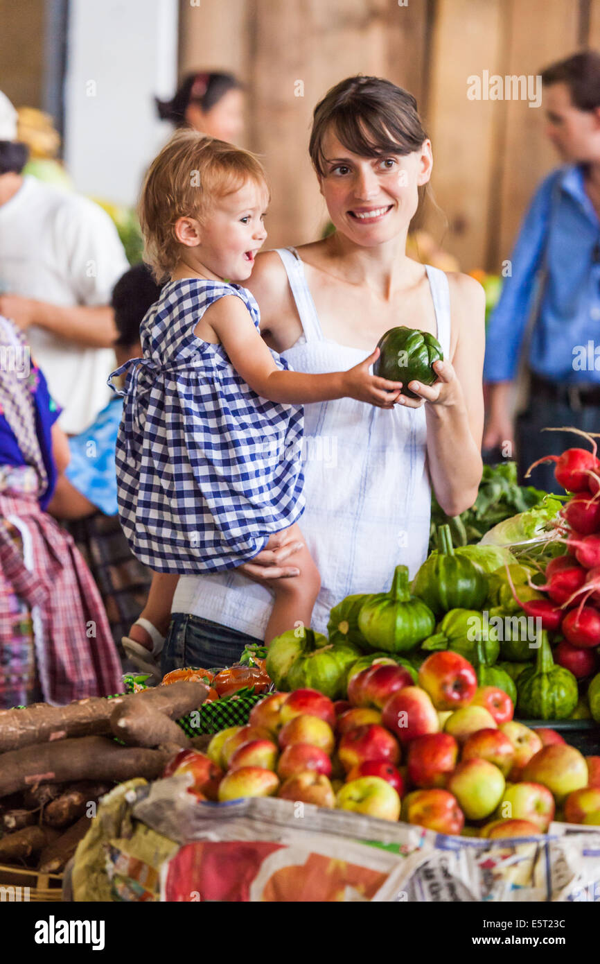 Woman buying vegetables at market Stock Photo - Alamy