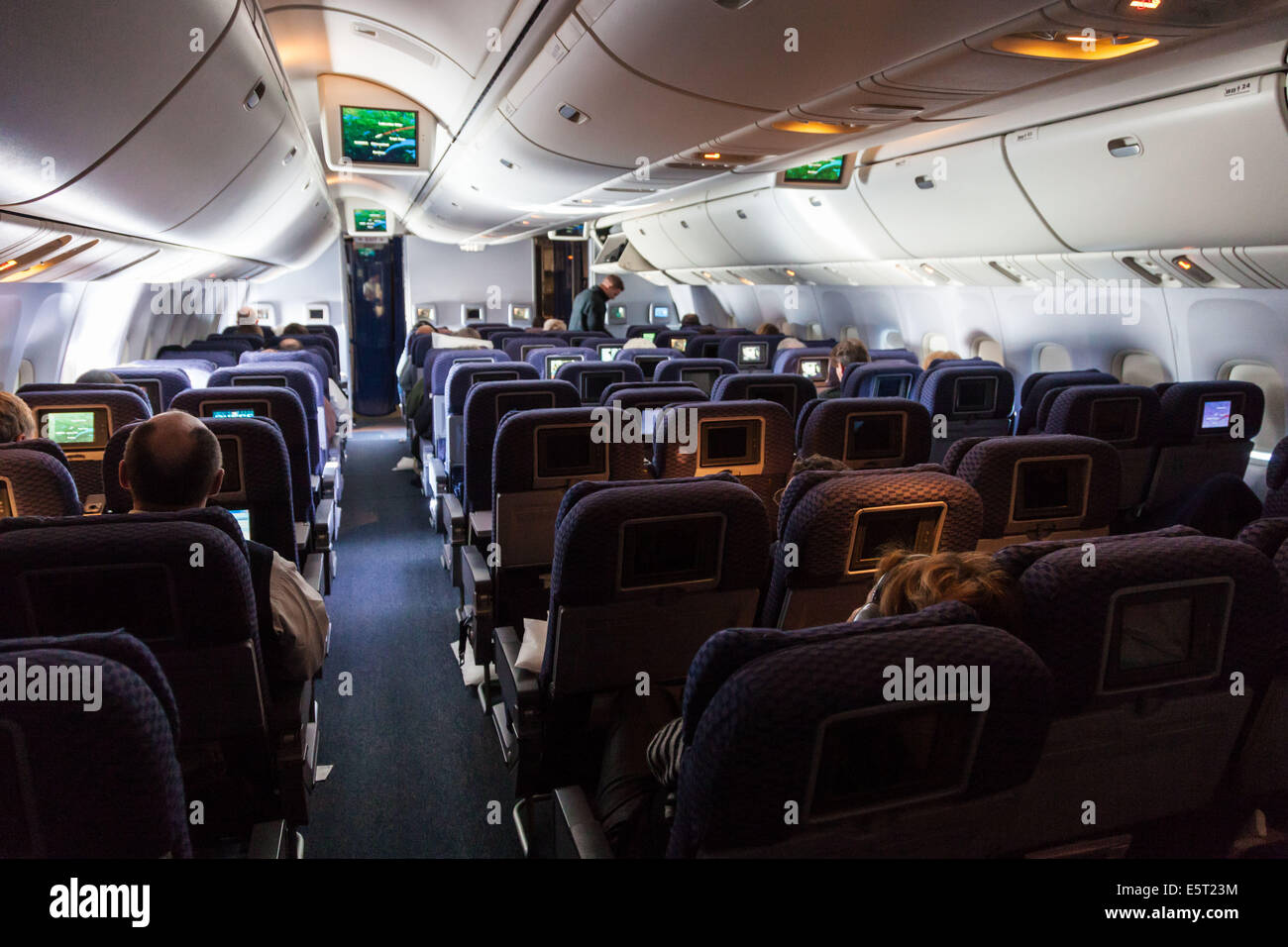 Economy class seating on plane Stock Photo - Alamy