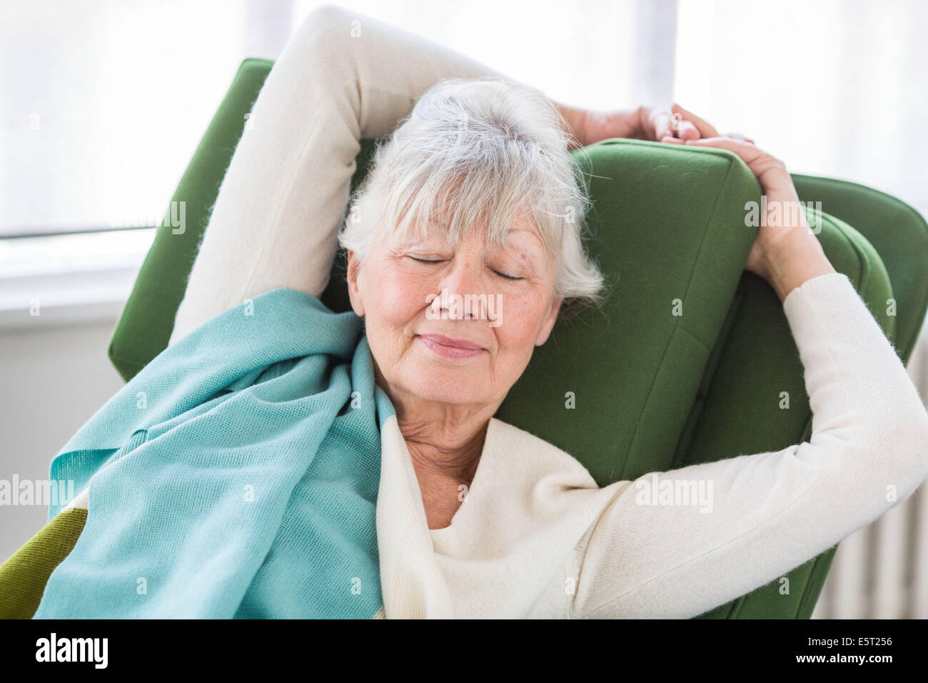 Elderly woman sleeping chair hi-res stock photography and images - Alamy