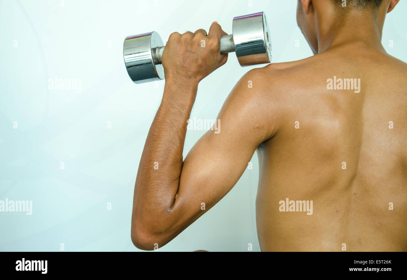 man with dumbell for fitness and healthy Stock Photo - Alamy