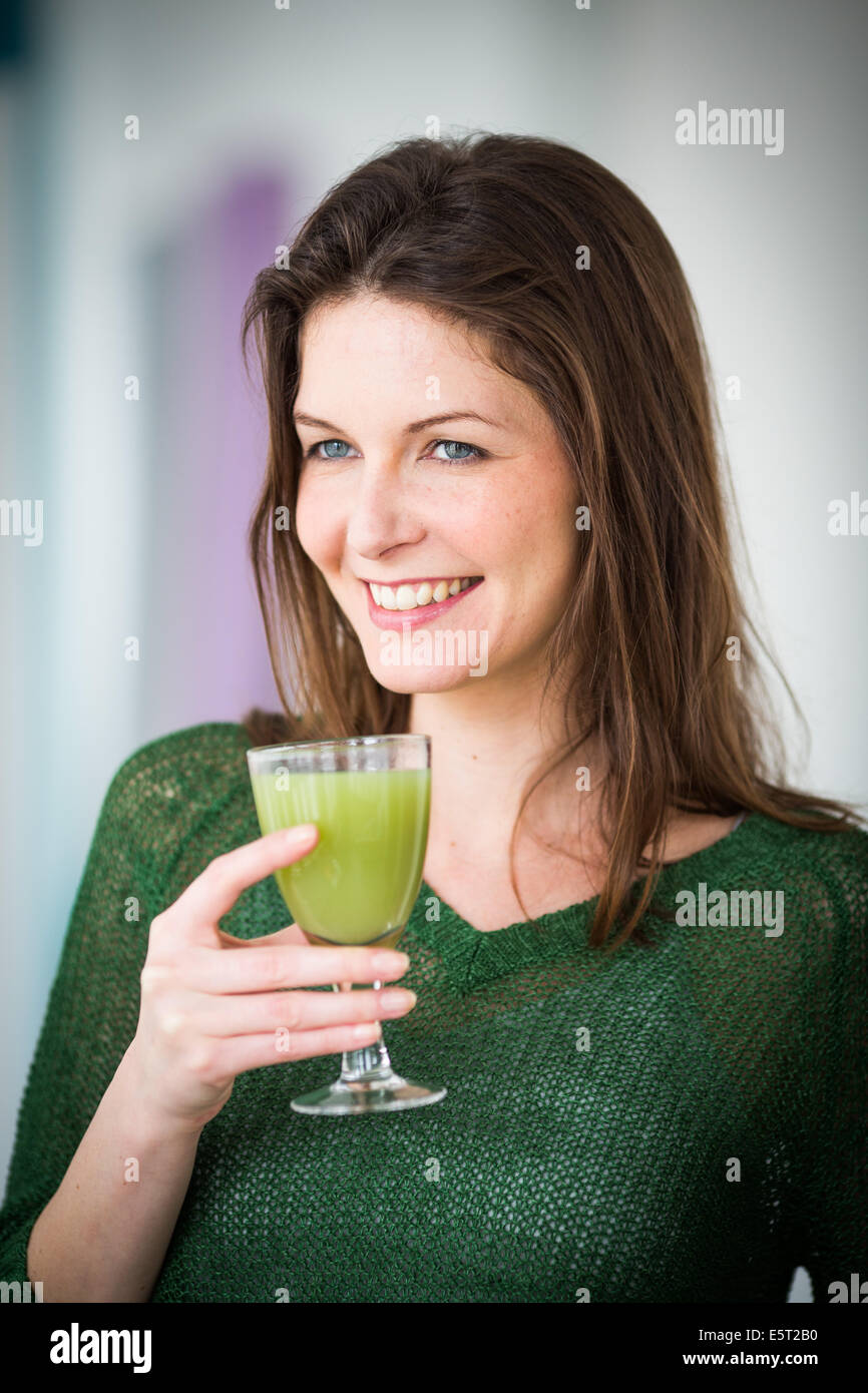 Woman drinking a smoothie Stock Photo - Alamy