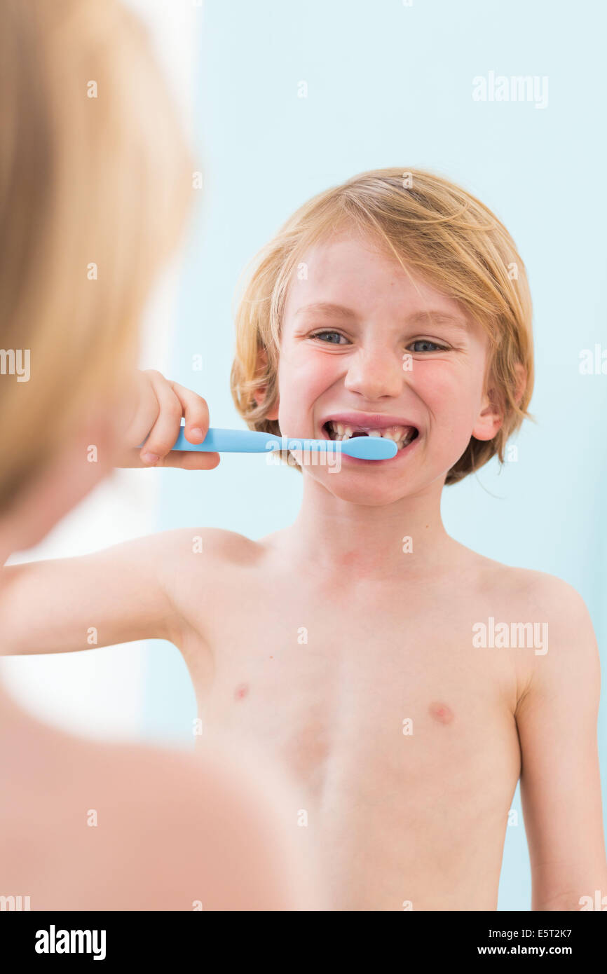 Teen boy brushing teeth hi-res stock photography and images - Alamy