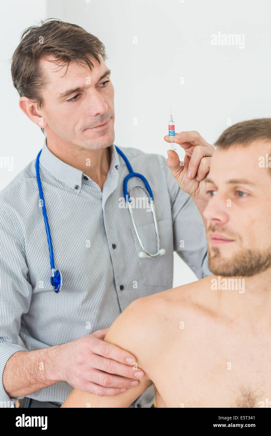 Man receiving vaccination Stock Photo - Alamy