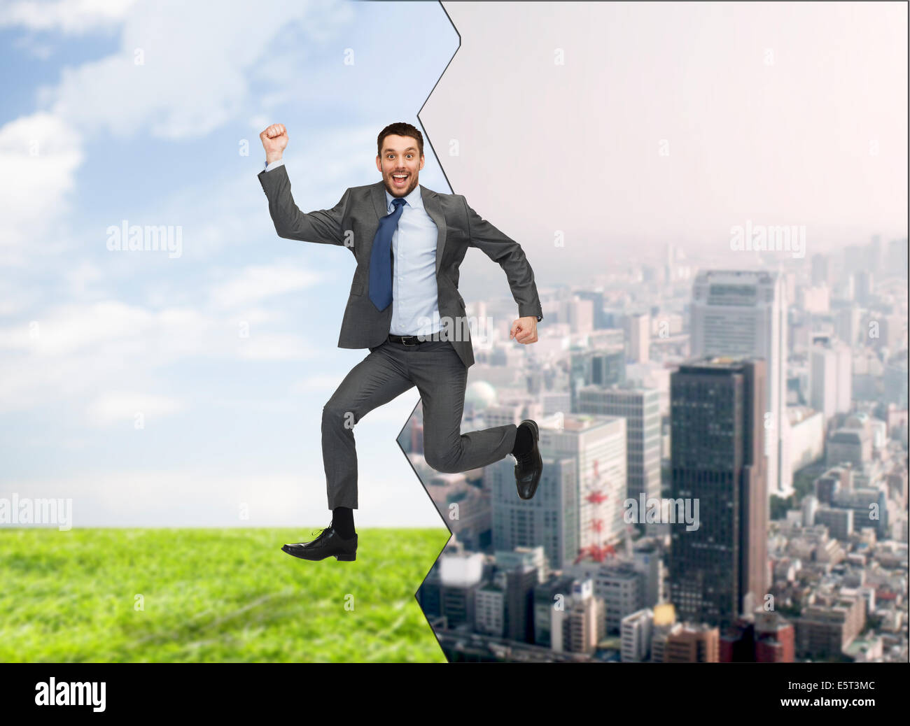 smiling happy businessman jumping Stock Photo - Alamy