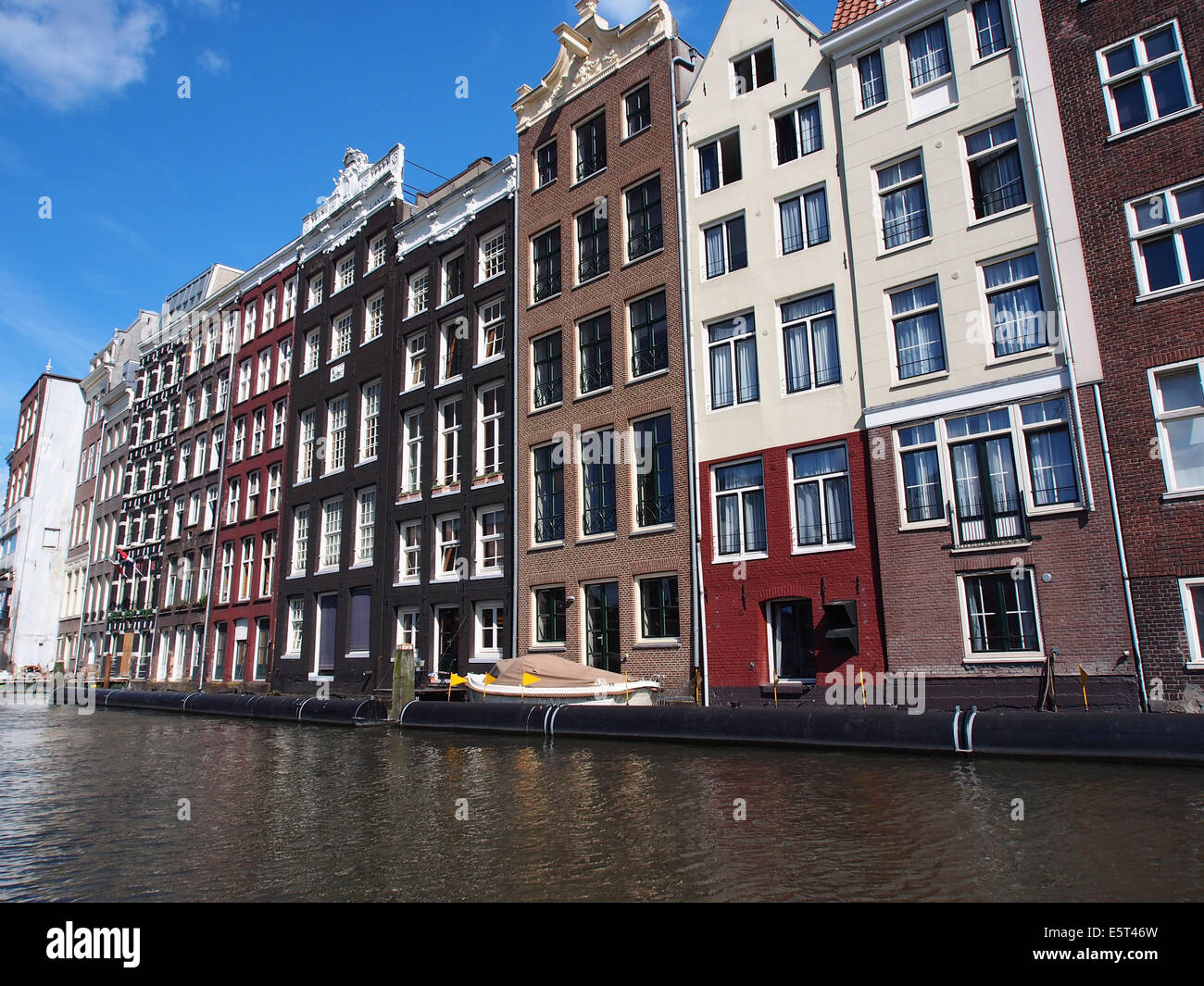 A photograph of Damrak, a major street in the center of Amsterdam ...