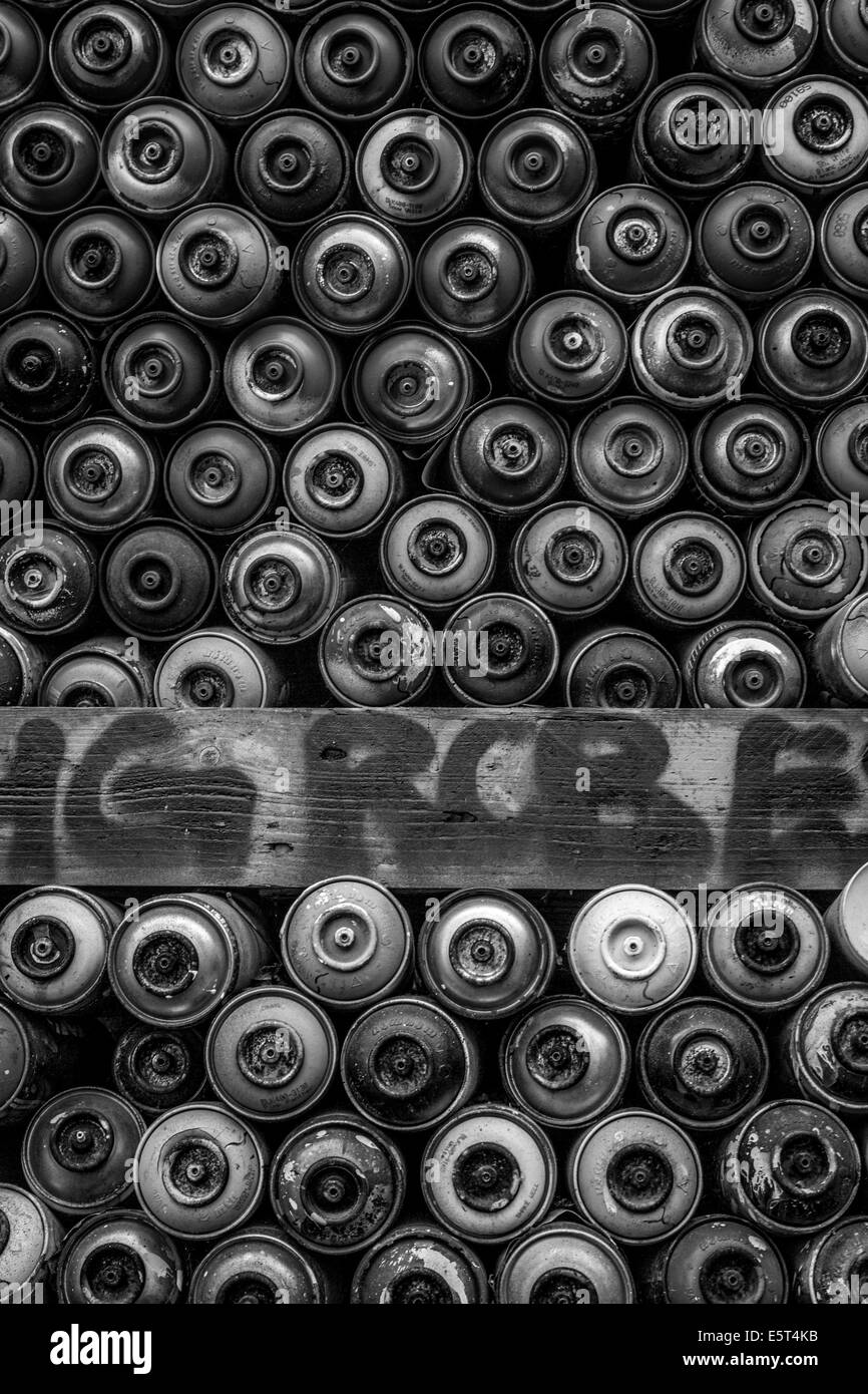 Used spray paint cans stacked up in Berlin Stock Photo - Alamy